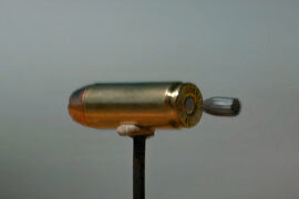 High-Speed Camera Captures a Bullet Going Through Second Bullet at ...